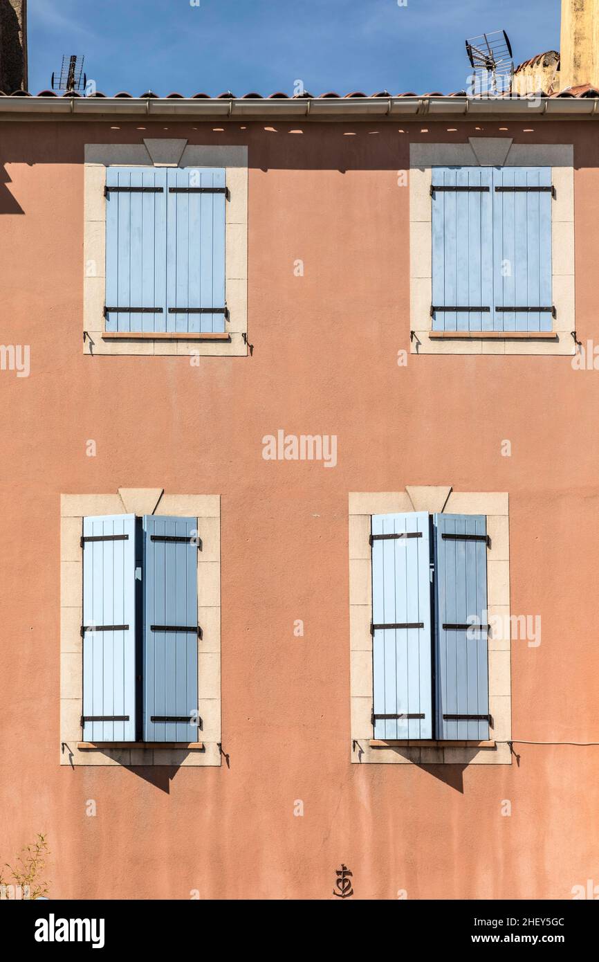 traditional french window with wooden shutters at an old house in ...