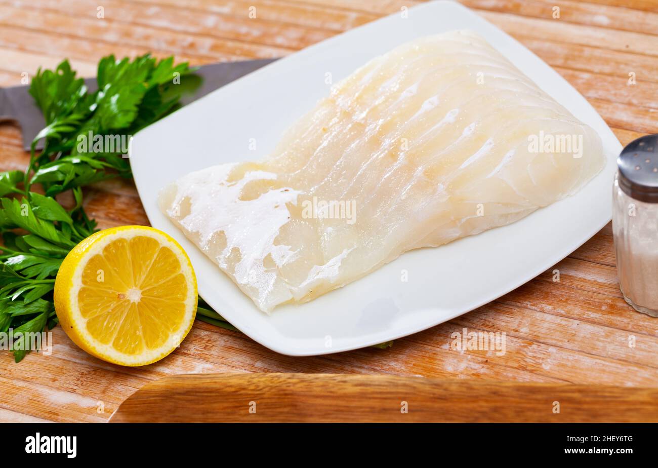 Raw pink cusk-eel fish fillet, seafood ingredients Stock Photo - Alamy