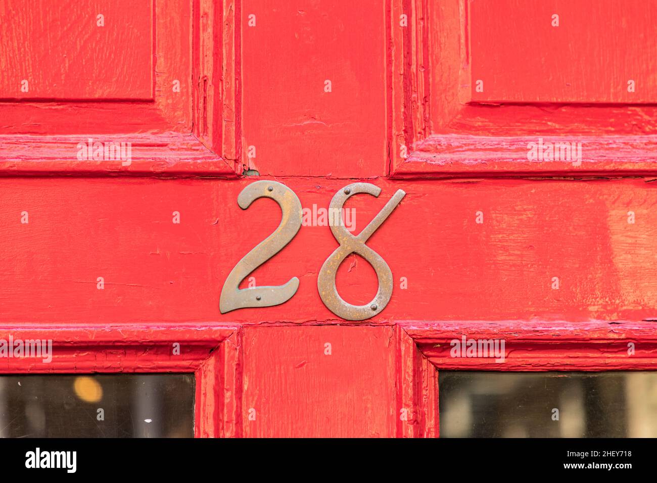 house number 28 at the old red entrance door Stock Photo - Alamy