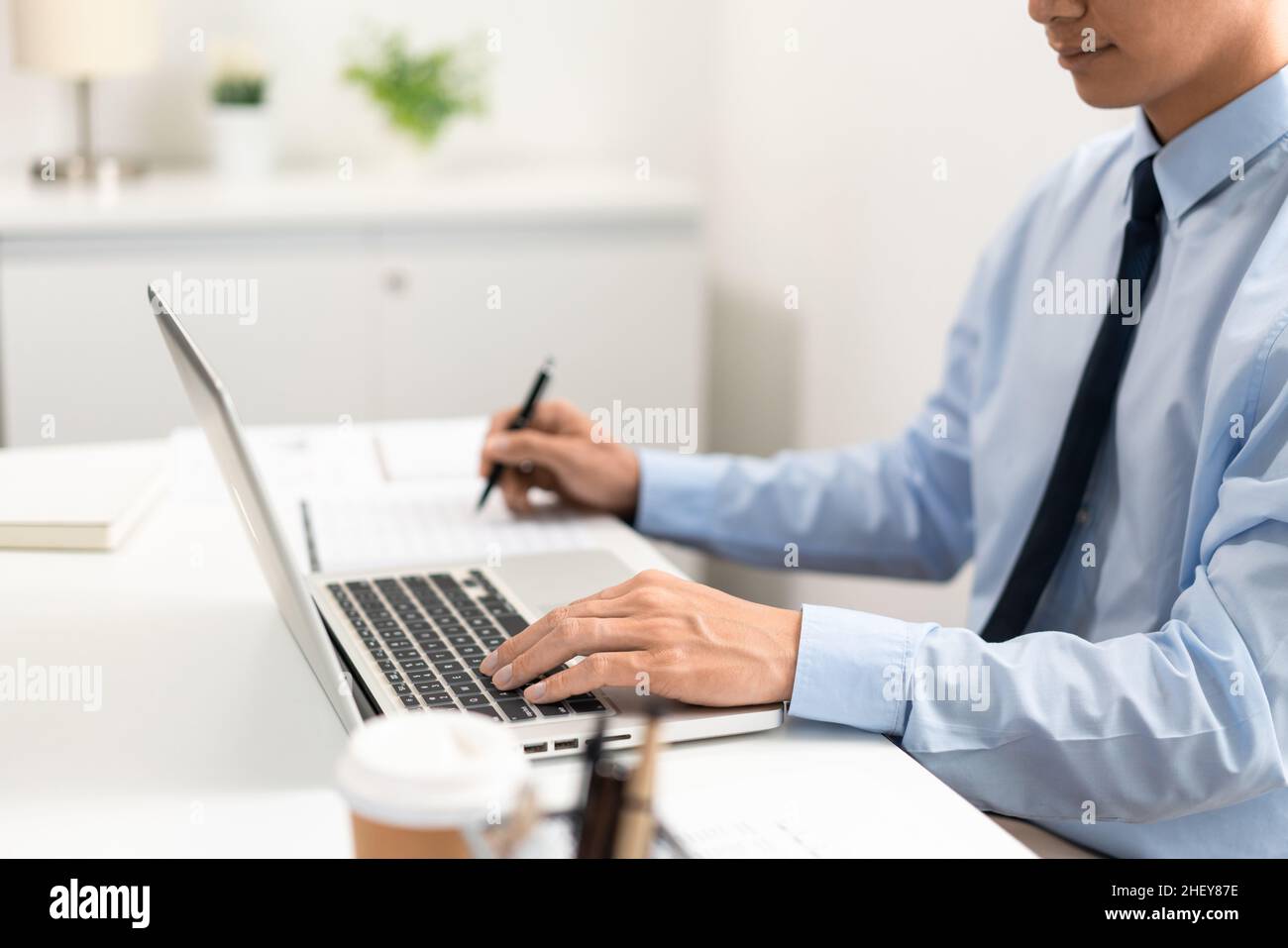 Working Man Conept The male officer sitting in the office, laying his ...