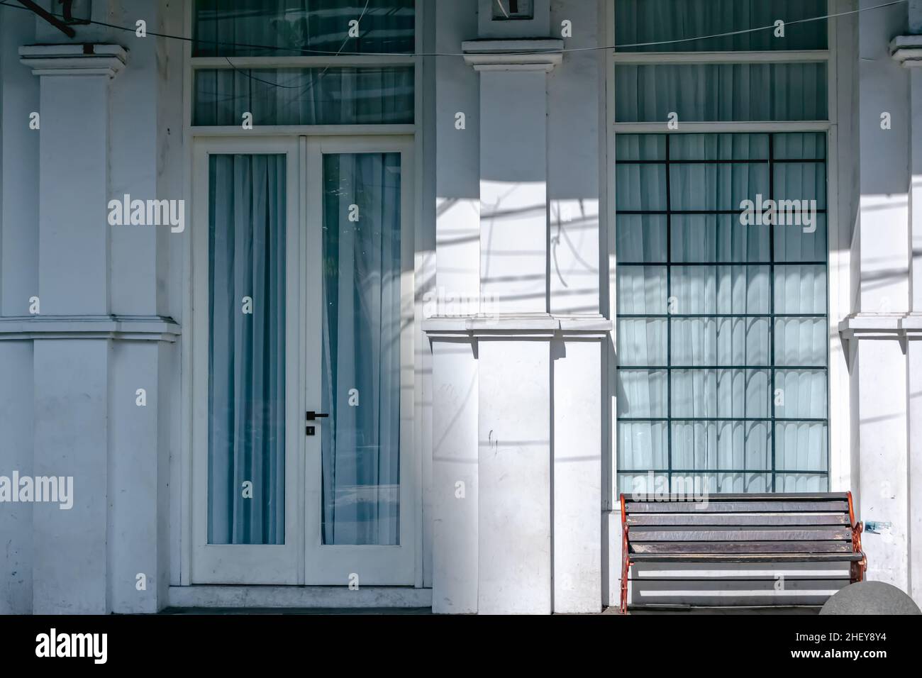 Old and vintage white heritage building with classic square window and ...