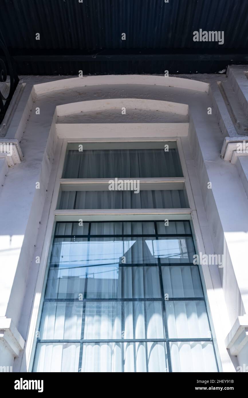 Low angle of vintage and old white wood square window from the heritage ...