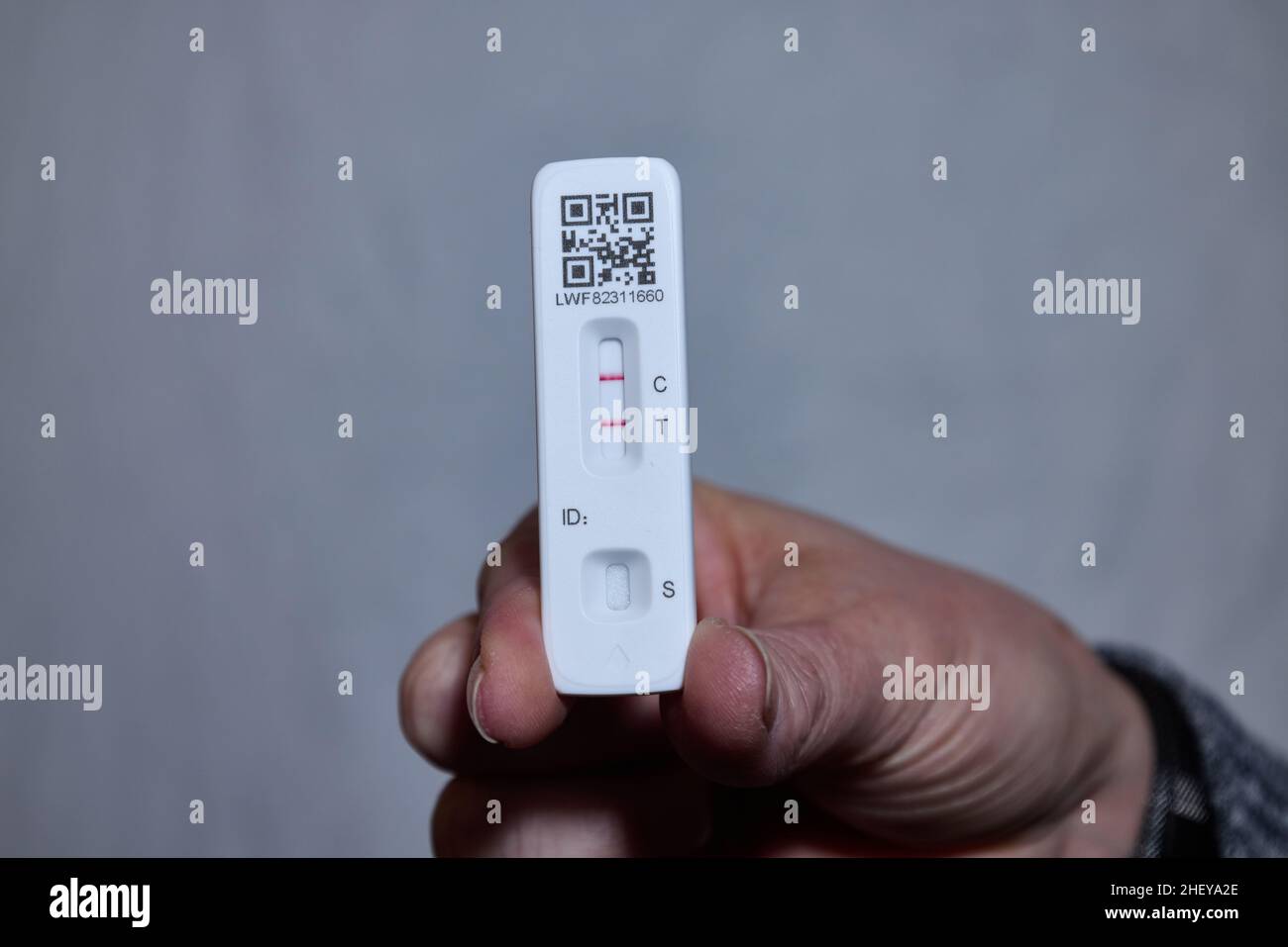 Female hand holding Coronavirus lateral flow antigen self test kit ...