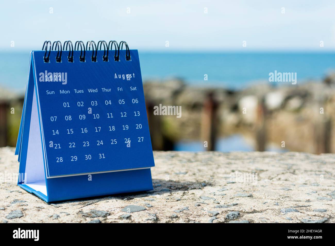 Blue August 2022 calendar on blurred background of blue ocean. 2022 New ...