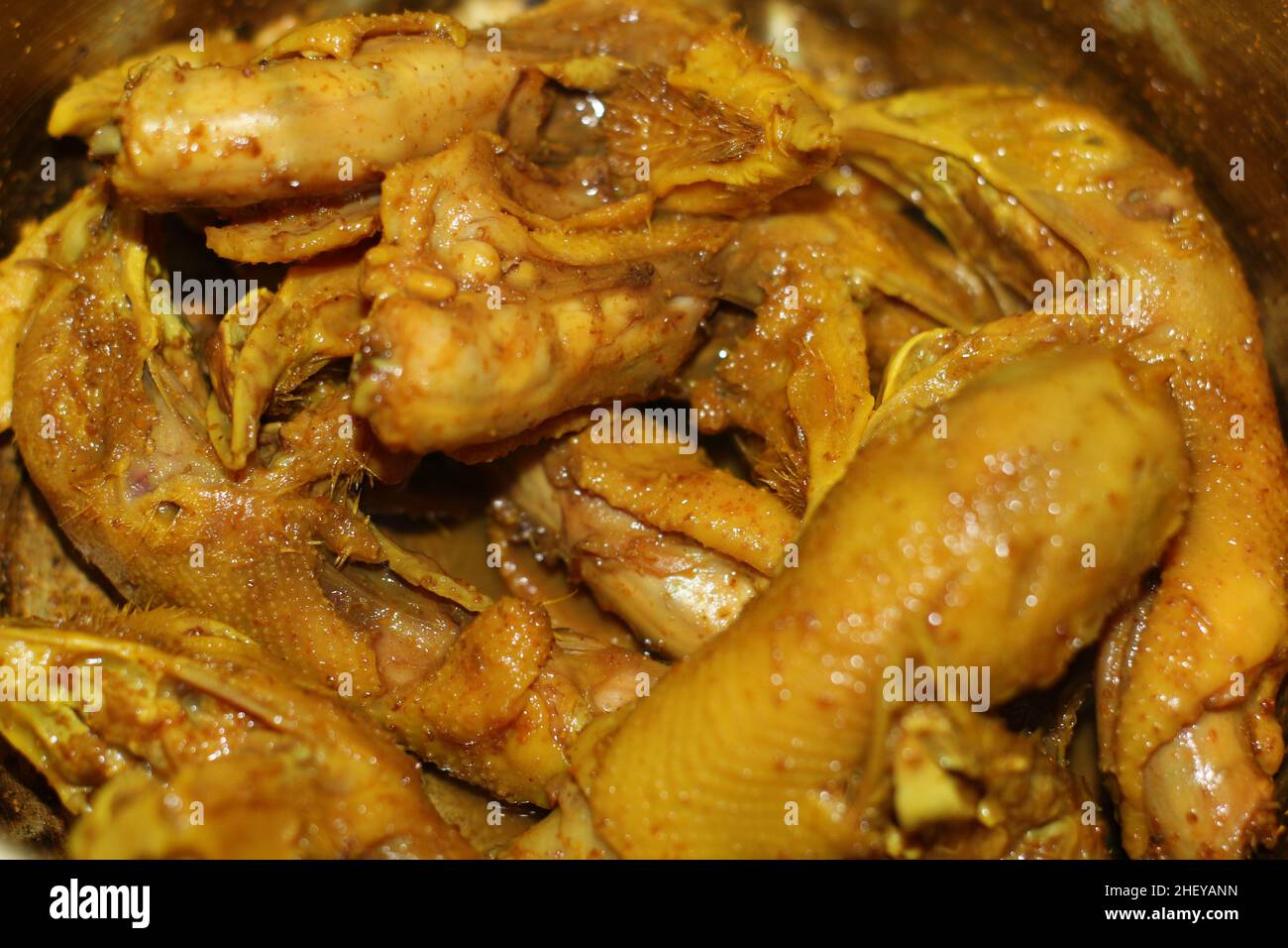 Chicken head that has been given spices ready to be fried Stock Photo ...