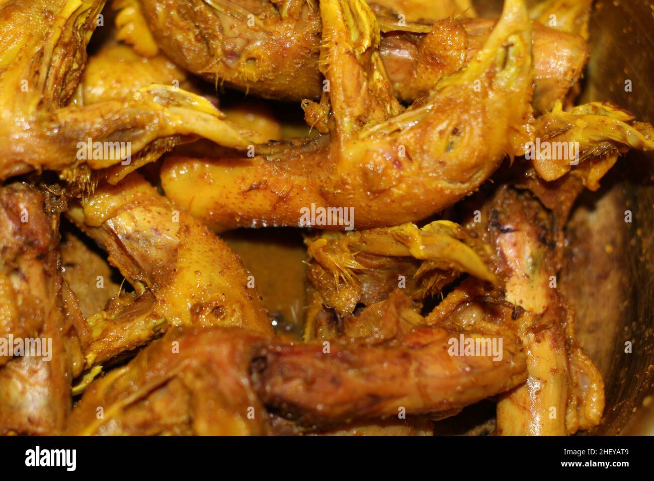 Chicken head that has been given spices ready to be fried Stock Photo ...