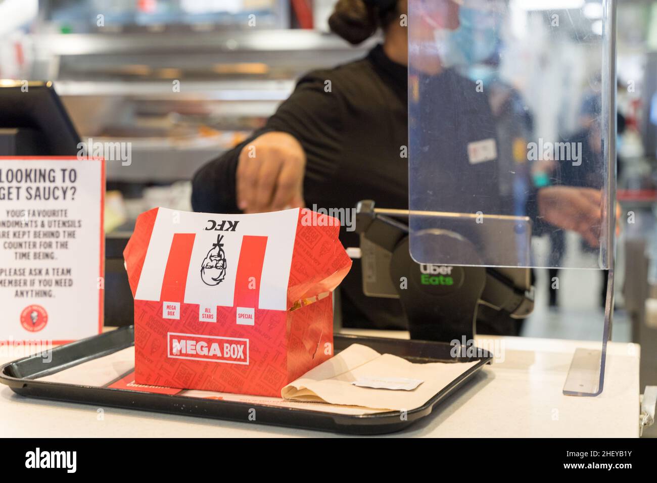 KFC food on eat in tray at the counter served by shop assistant Kent ...