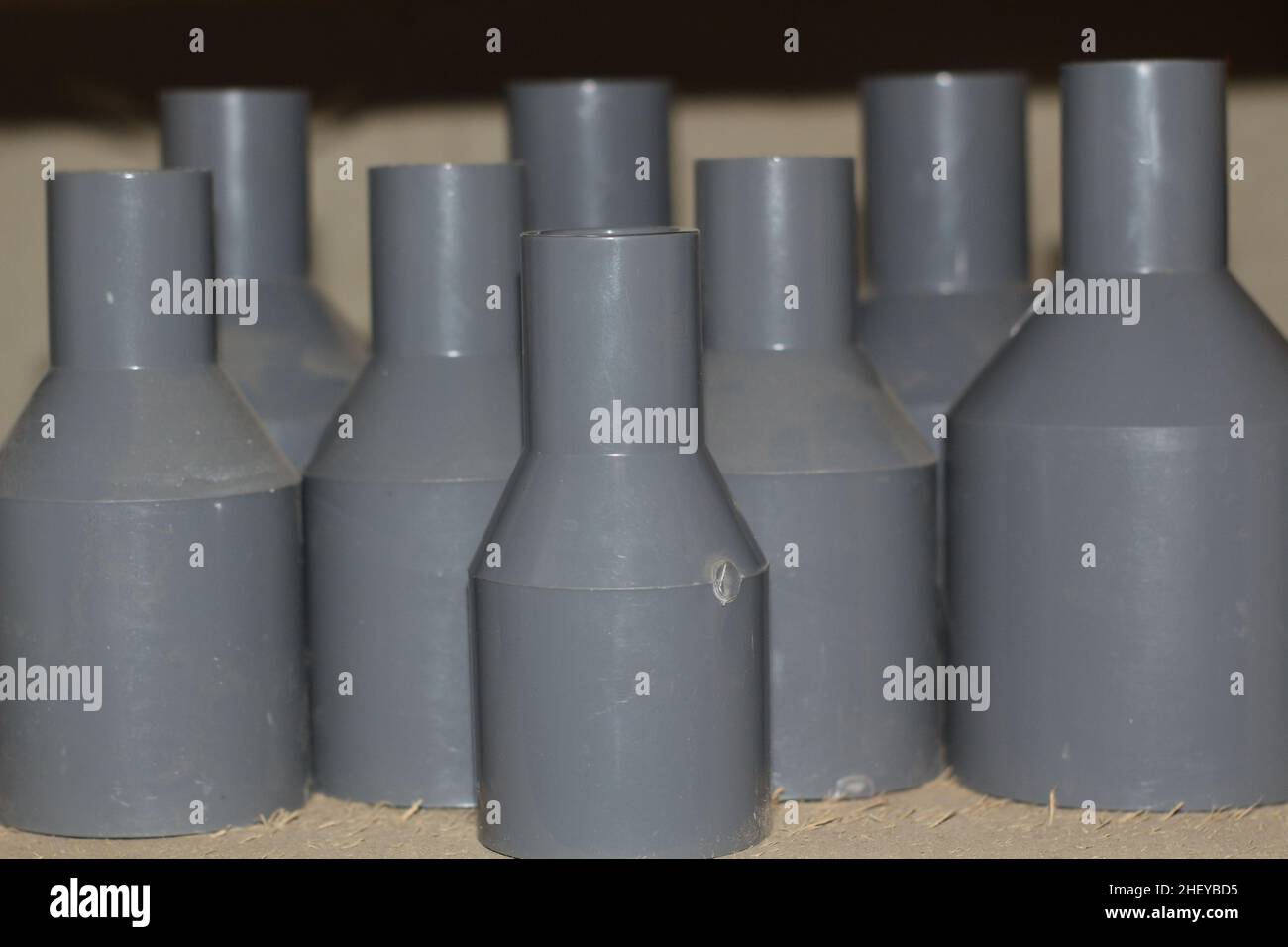 a collection of pipe connections from large to small diameter sizes ...