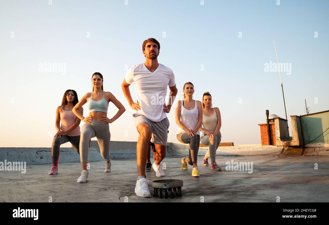 Group of fit people exercising together to stay healthy. Sport people ...