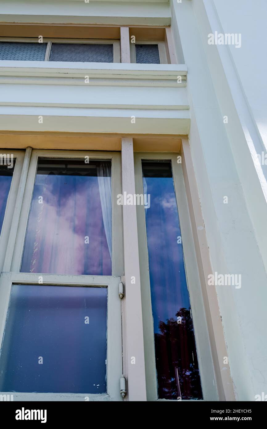 Low angle of vintage and old white wood square window from the heritage ...