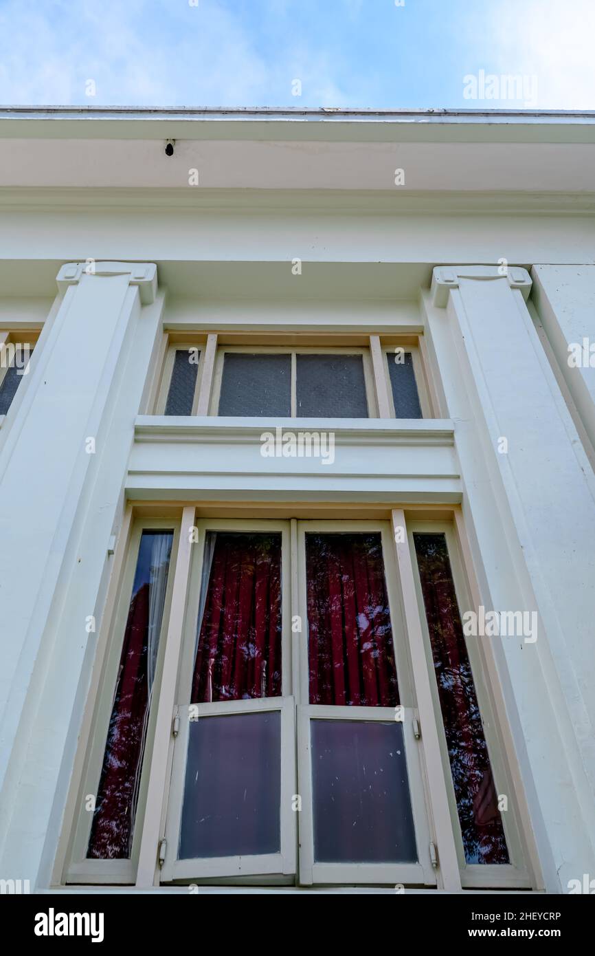Low angle of vintage and old white wood square window from the heritage ...