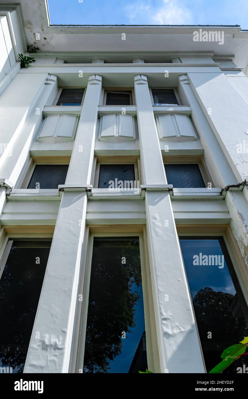 Low angle of vintage and old white wood square window from the heritage ...