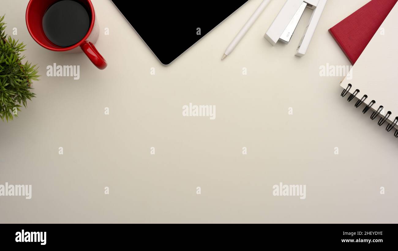 Stylish office table desk. Workspace with tablet, diary, coffee cup on ...