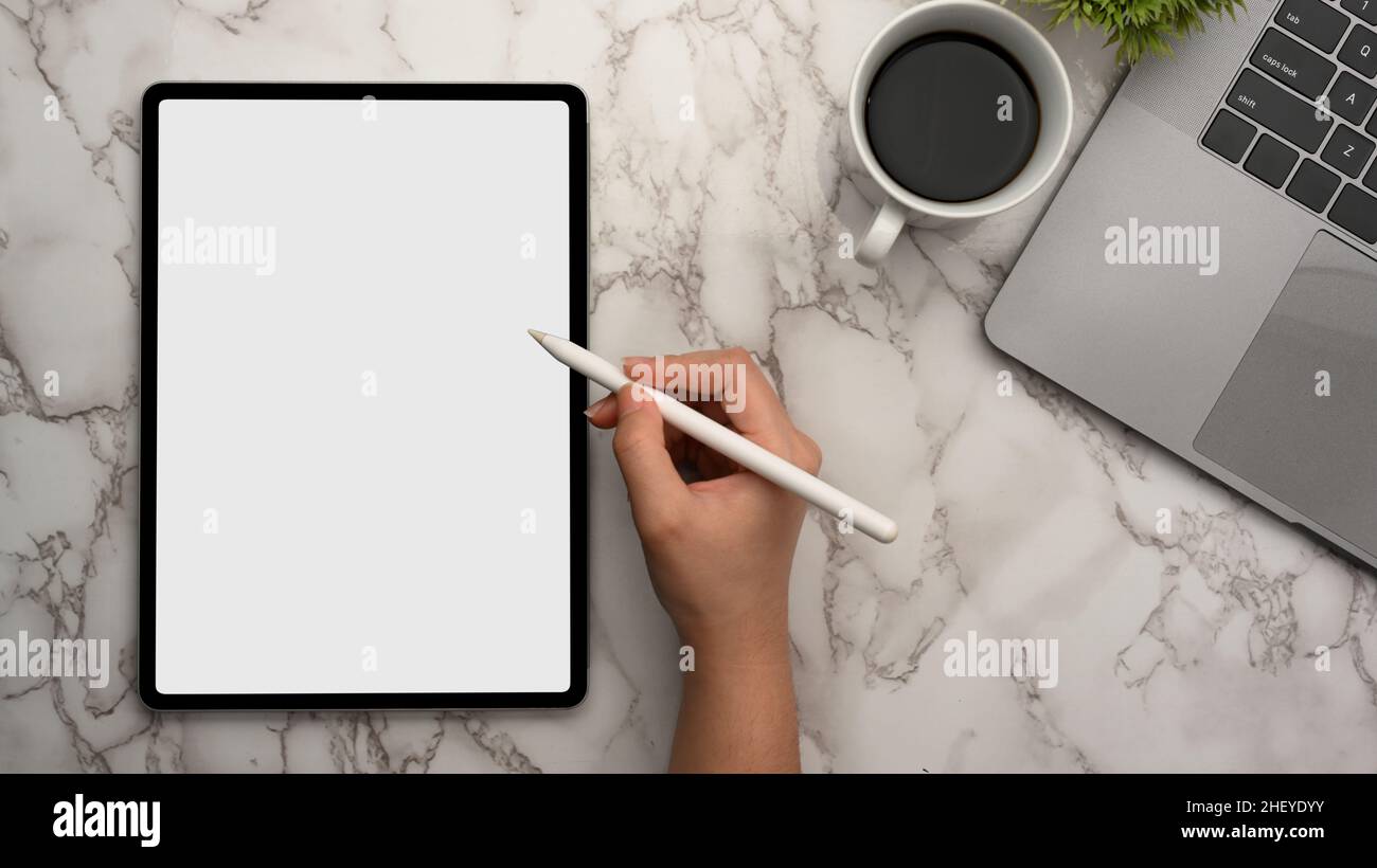 Close-up, top view of a female using stylus pen drawing on digital ...