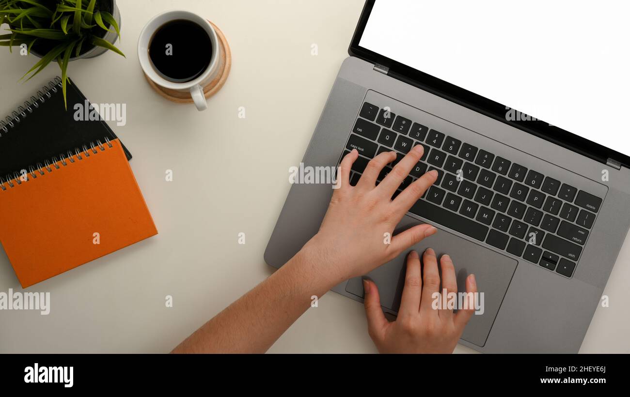 Top view of a female's hands typing on modern notebook laptop computer ...