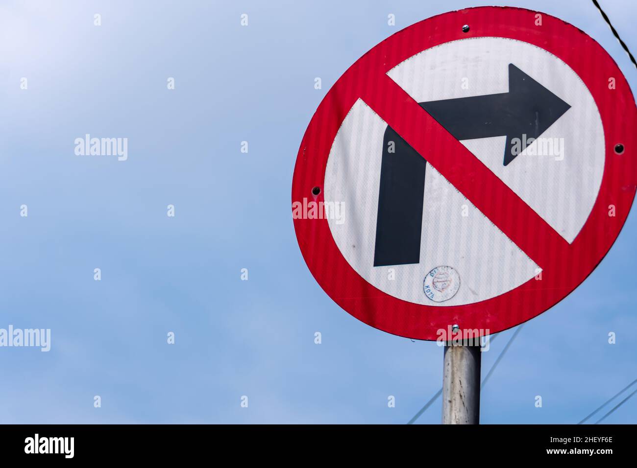 don't turn right city traffic sign under the sunlight and clear blue ...