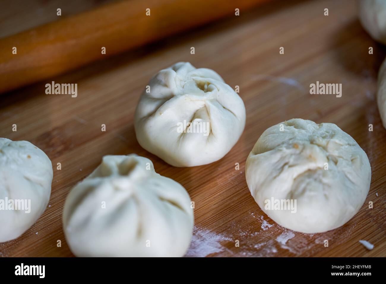 Finished fresh meat buns made in the kitchen Stock Photo - Alamy