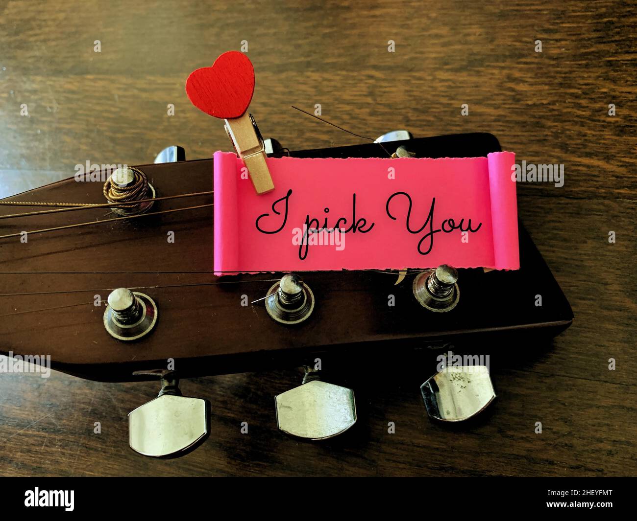 I pick you label on a torn piece of paper with guitar background ...