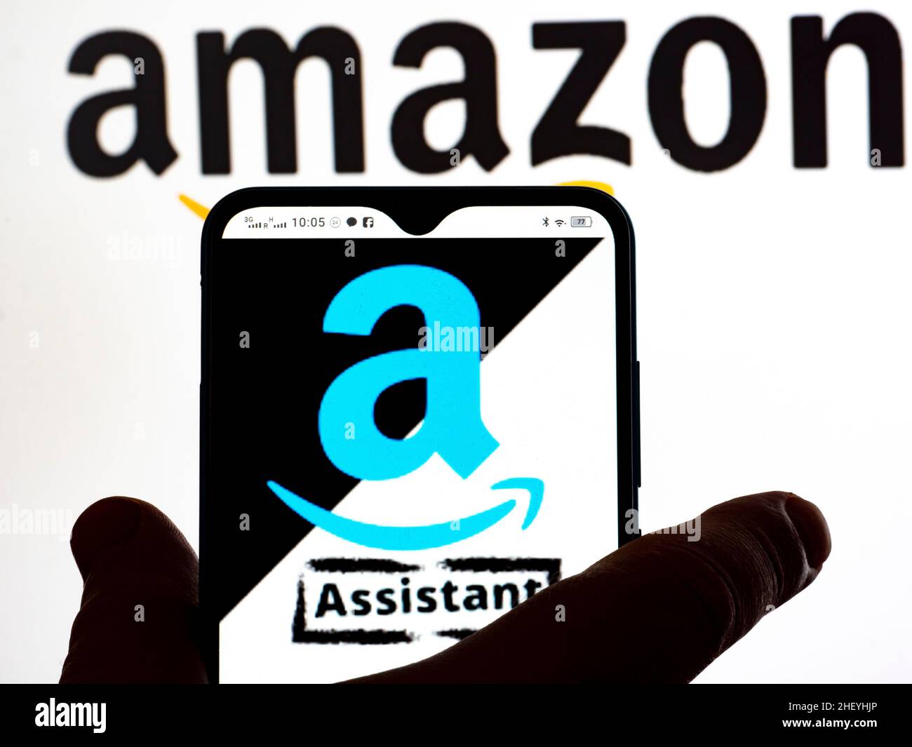 In this photo illustration, the Amazon Assistant logo is seen displayed ...