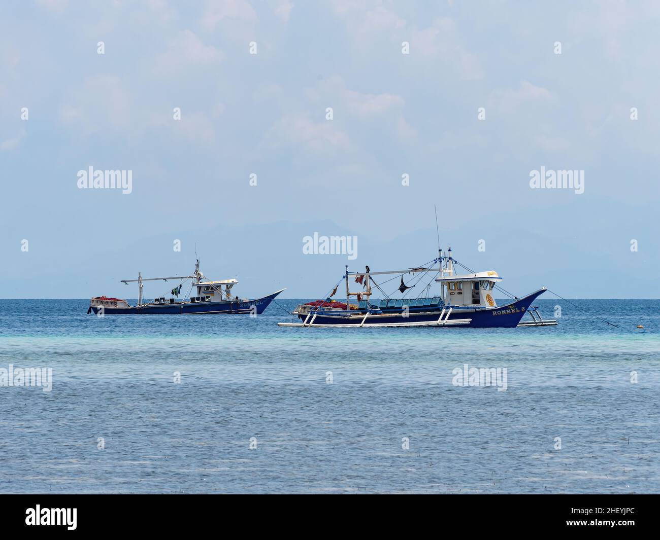 Two tuna fishing boats moored at the village of Tinoto, Maasim in the ...
