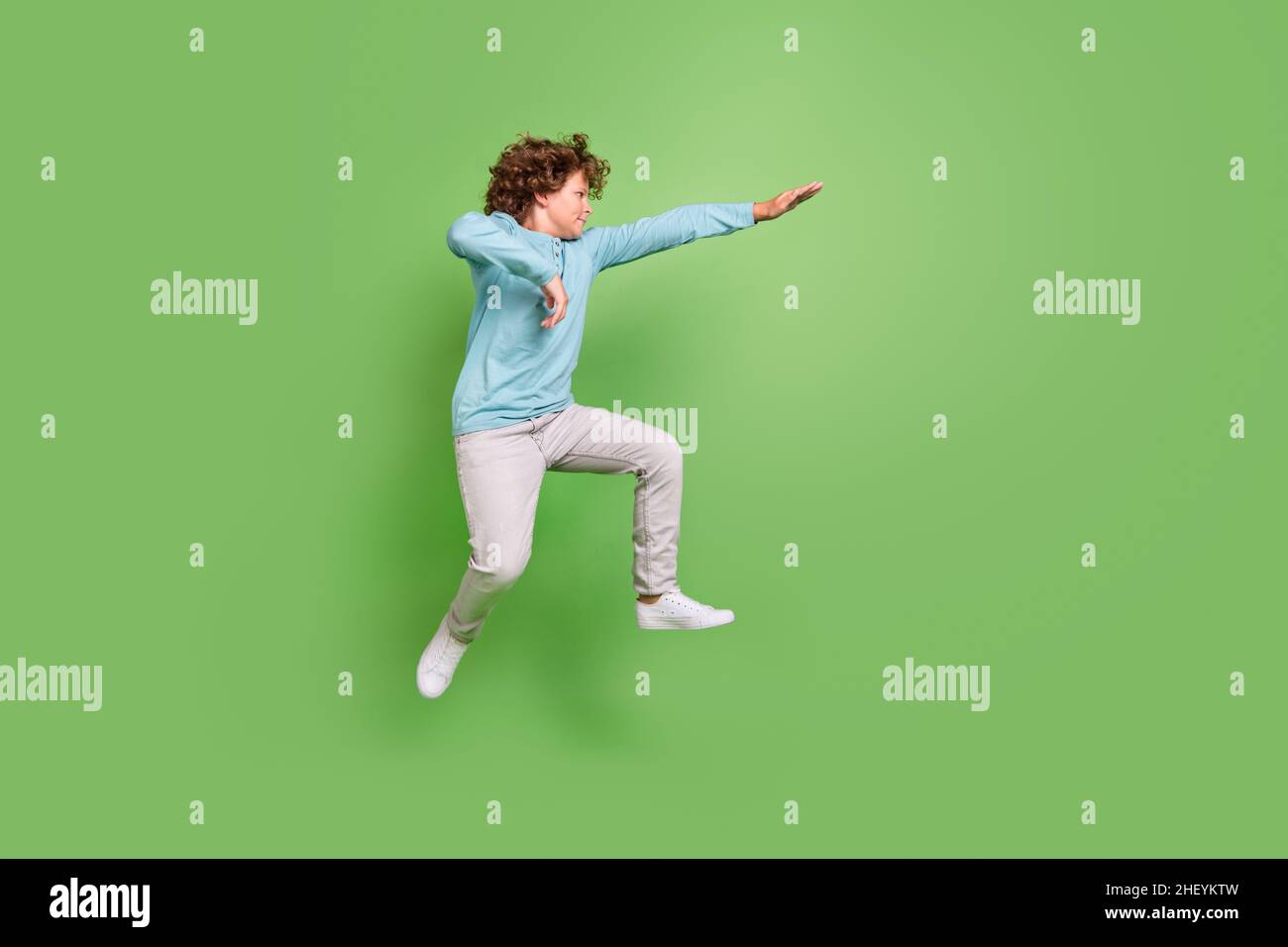 Full length body size view of attractive guy jumping dancing fighting ...