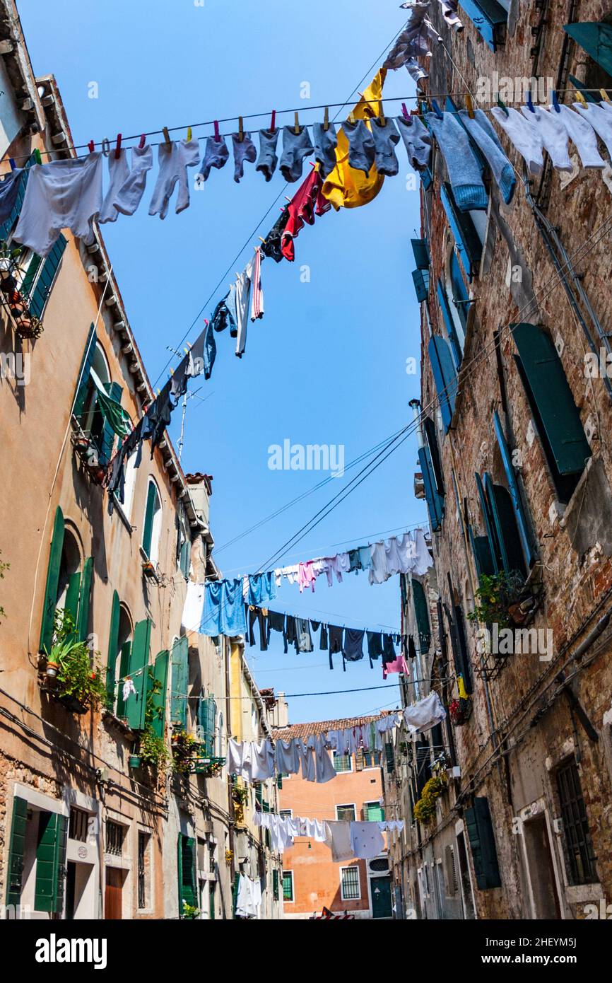 clothes on a clothesline in a narrow street in Venice, Italy Stock ...