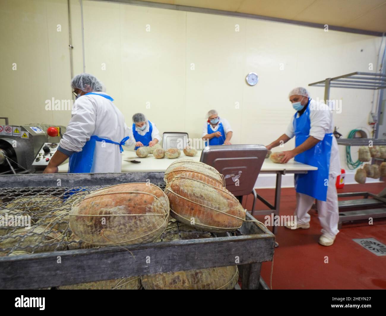 specialized worker hand sewing and finishing culatello, coppa and ...