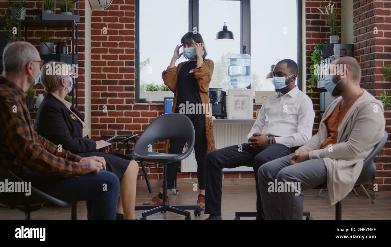 Woman with anger management issues talking about addiction with people ...