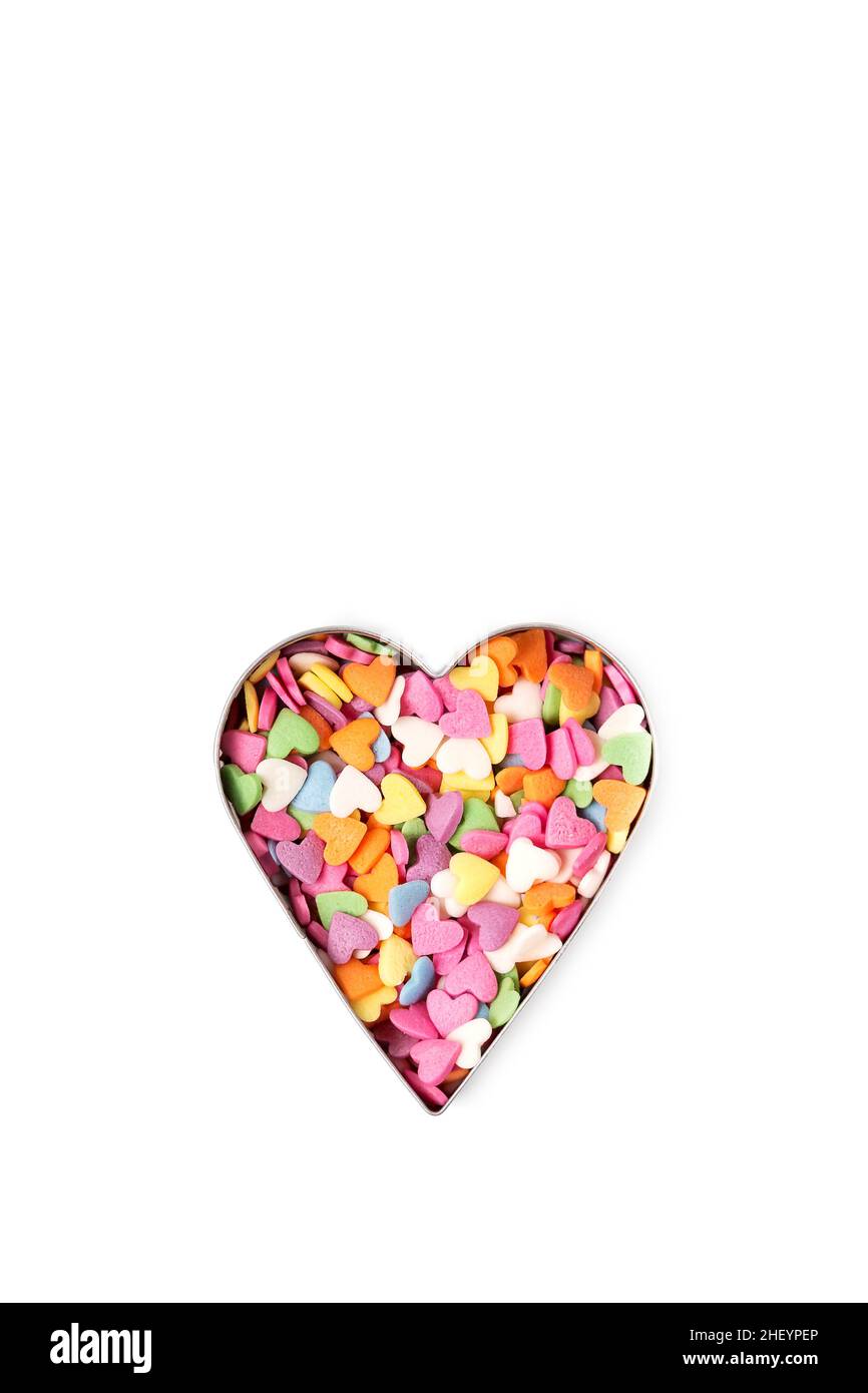 Multi-colored heart-shaped sprinkles pastry topping in heart form on ...