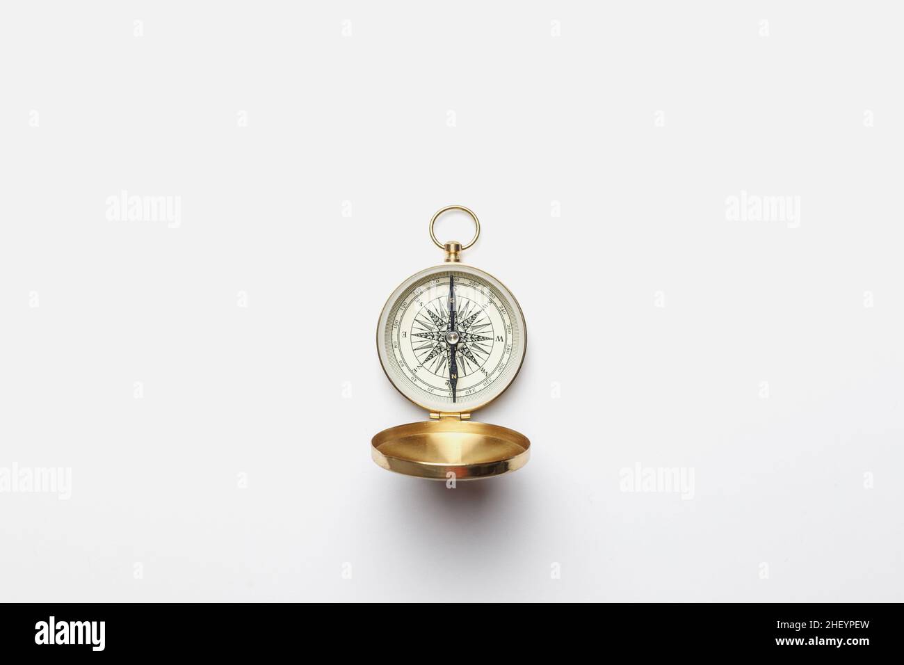 Golden compass on white background concept - direction, top view Stock ...