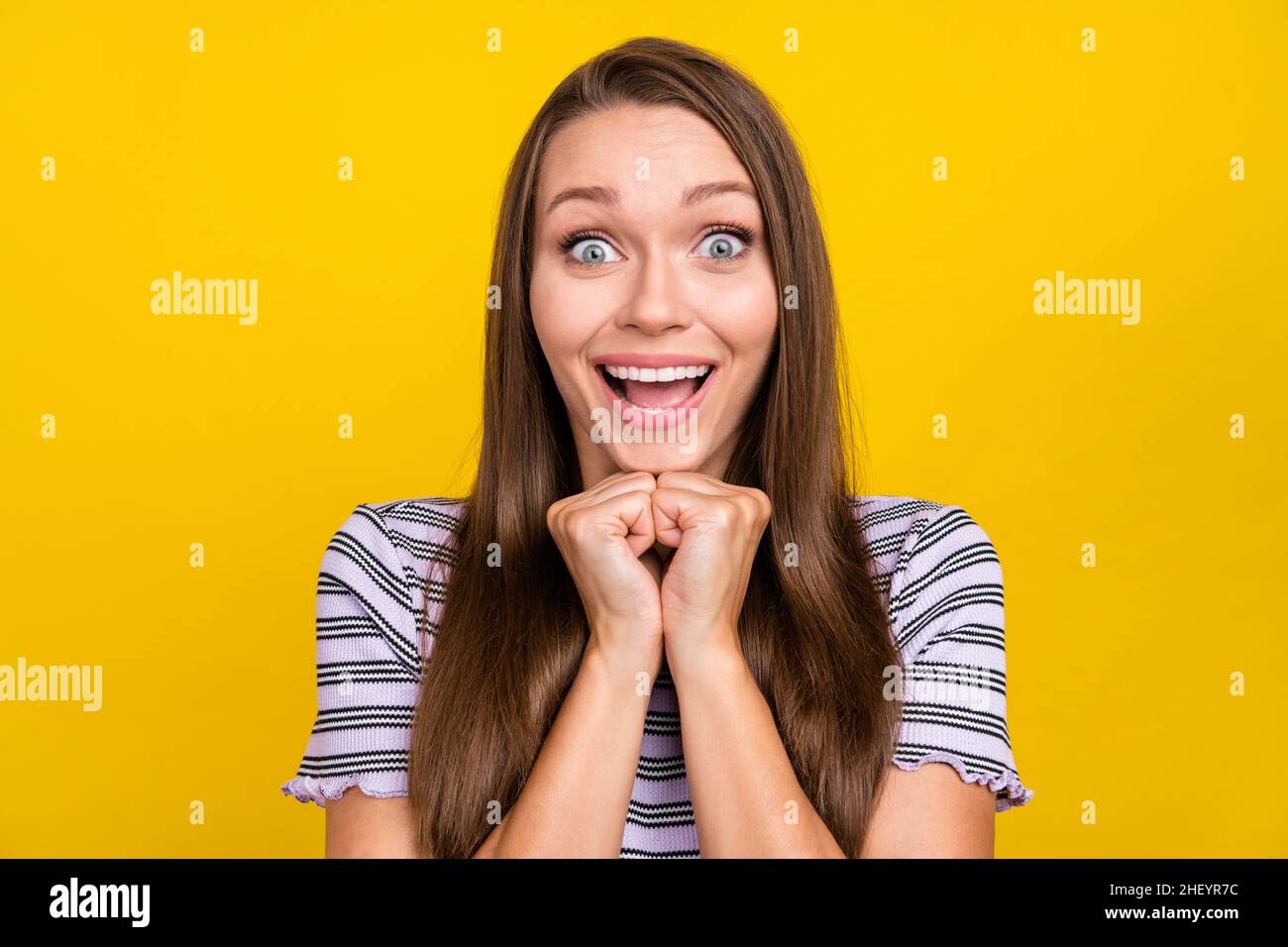 Photo of amazed excited astonished lady positive young woman hands face ...