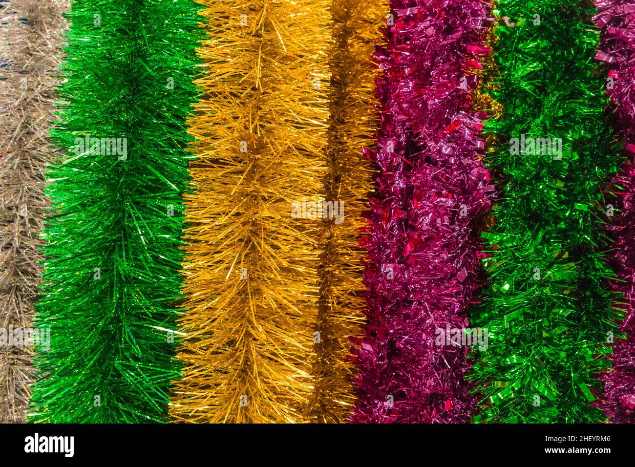 Christmas bright colored tinsel decor and christmas background ...