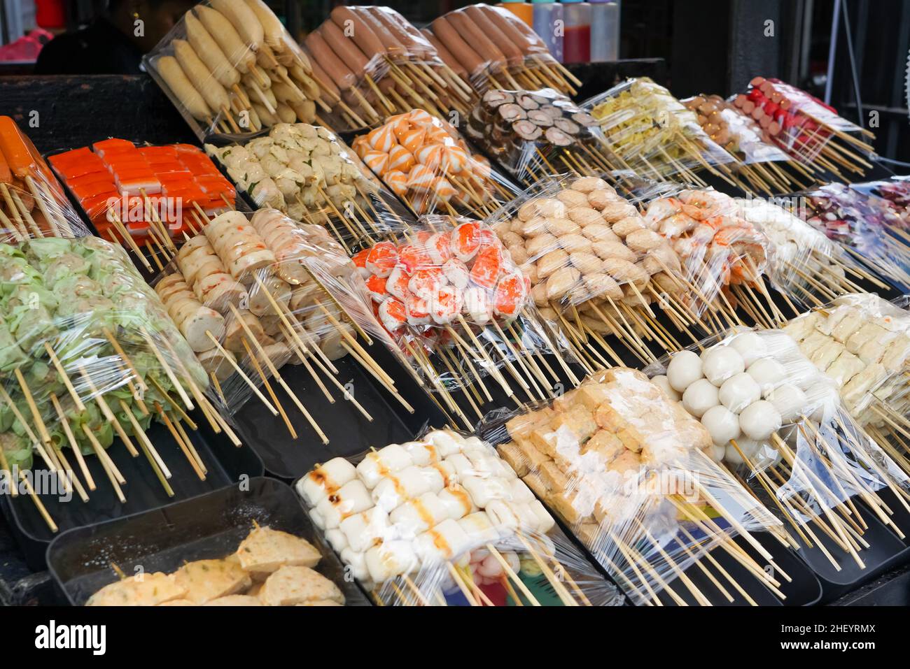 Various kinds of snacks or processed meat foods such as sausages ...