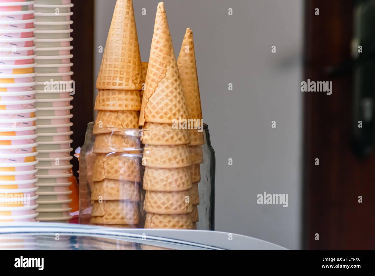 pile of crunchy brown ice cream waffle cones stand on the shop Stock ...