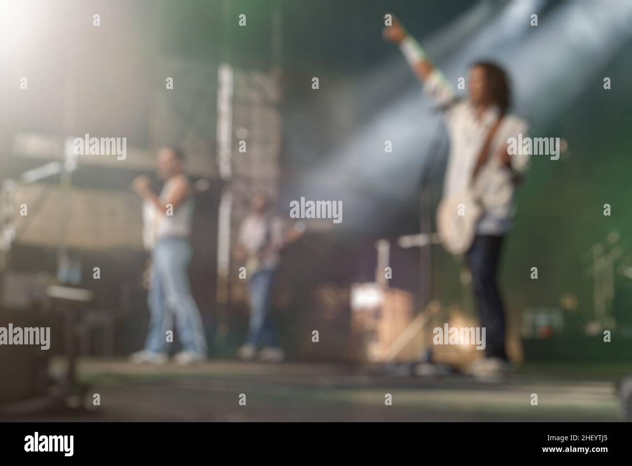 Musical band performing live on the stage. Blurred image Stock Photo ...