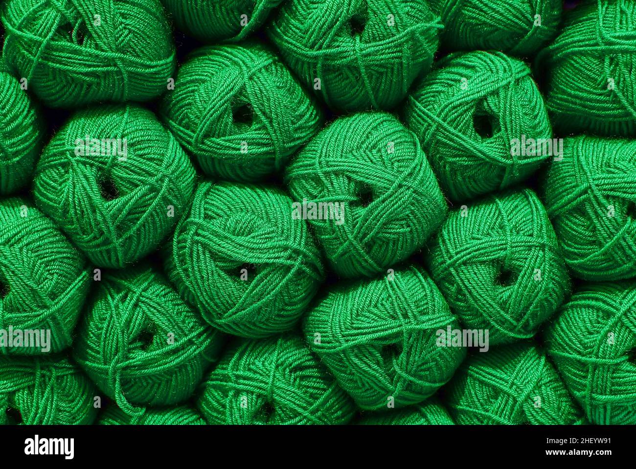 Green Ball of wool. Beautiful colored wools ball. Wool texture. Skeins ...