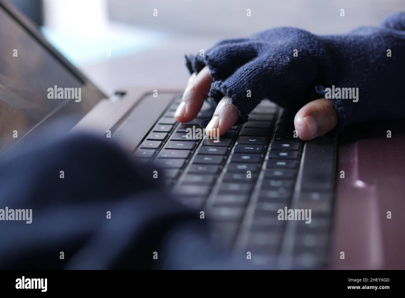 hacker hand stealing data from laptop top down Stock Photo - Alamy