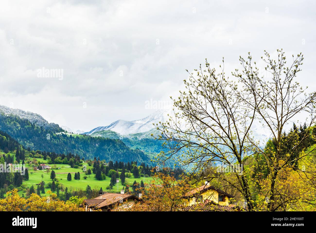 Last spring snow on the Sutrio mountains. Carnia to discover Stock Photo - Alamy