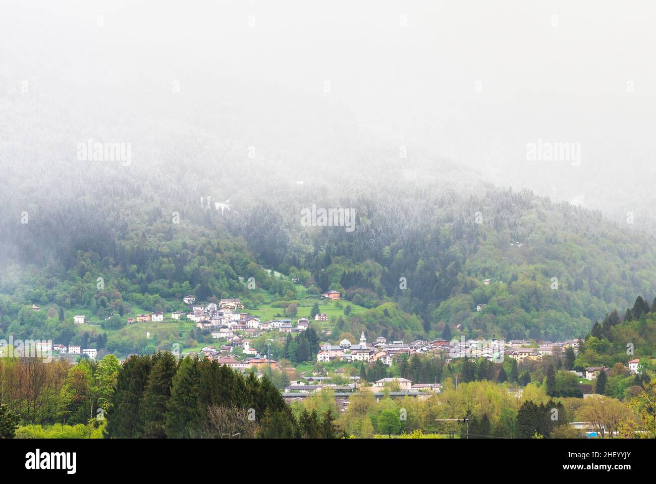 Last spring snow on the Sutrio mountains. Carnia to discover Stock Photo - Alamy