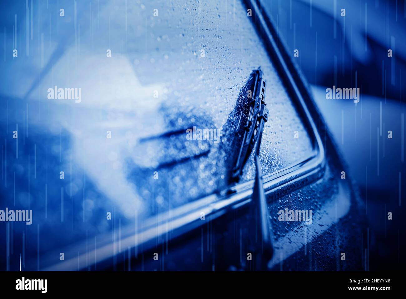 Large raindrops fall from the sky on the rear window of the car. Heavy ...