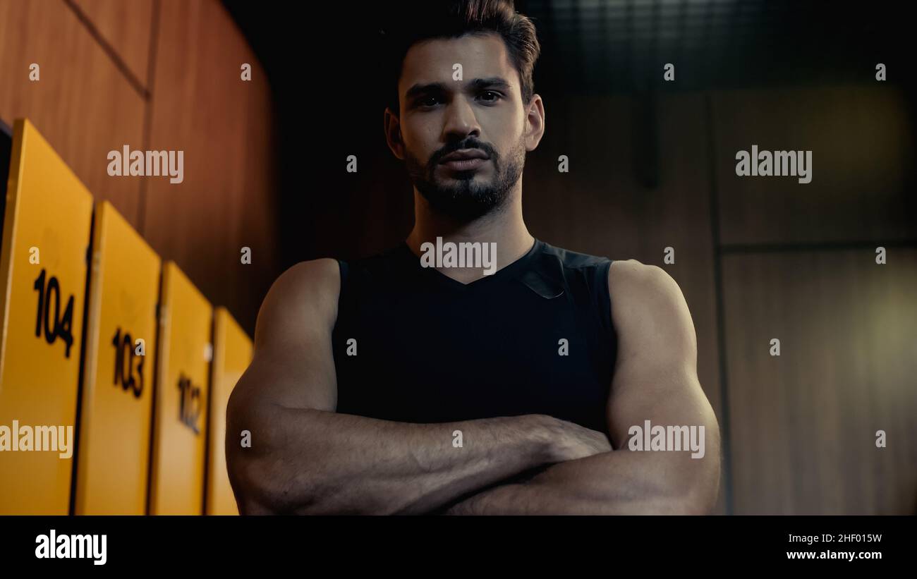 Sportsman crossed arms in locker hi-res stock photography and images ...