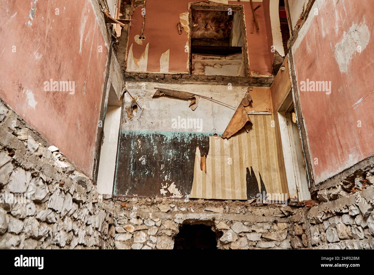 The interior of an abandoned crumbling building. A dying city ...