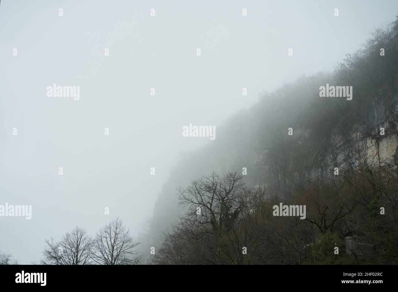 View of the high-mountain valley, heavy fog. Limited visibility Stock ...