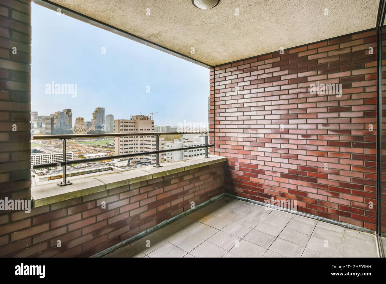 Stylish balcony with brick walls in an elegant home Stock Photo - Alamy