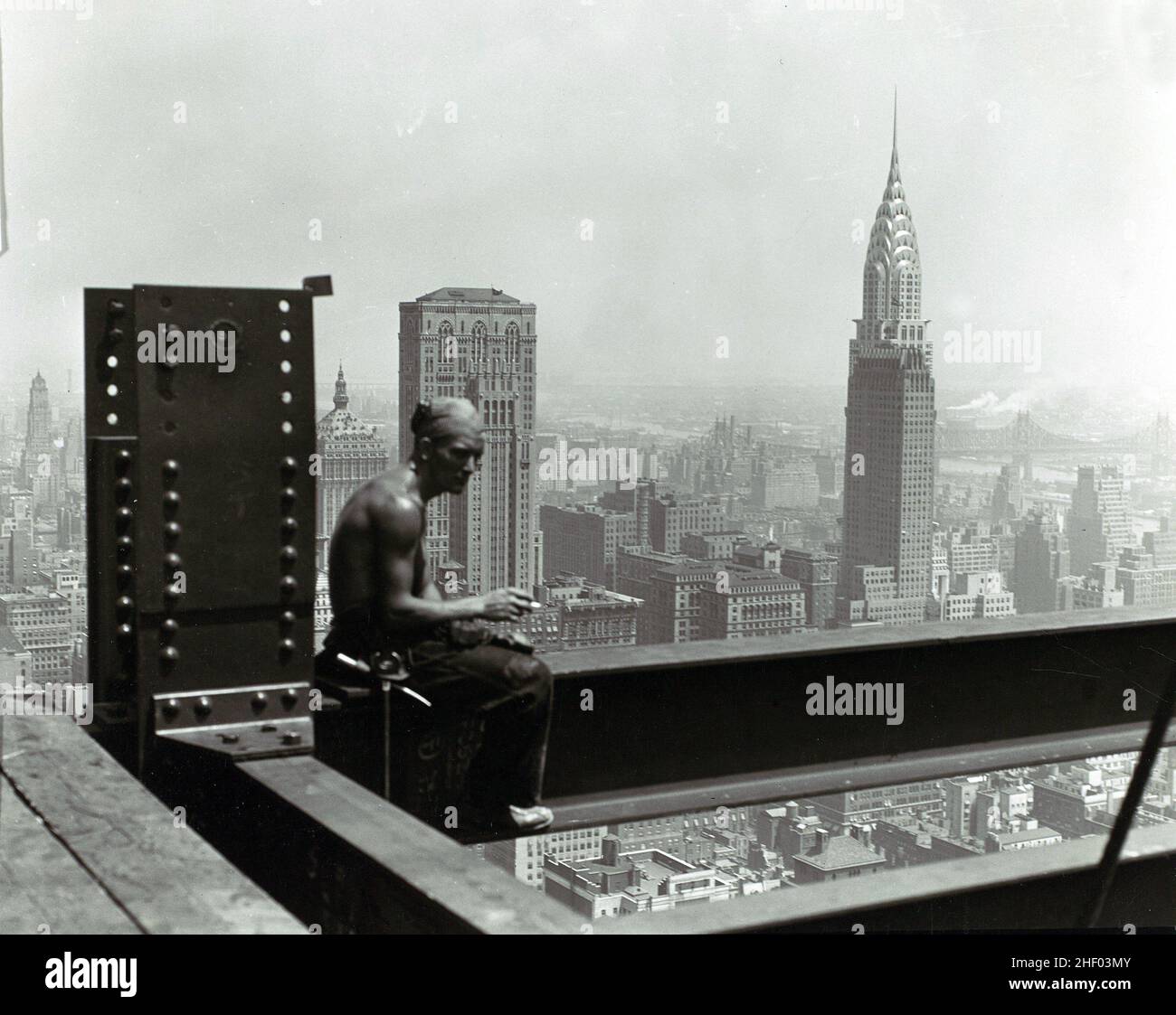 Construction worker on the Empire State Building, 1930s. Photograph by ...