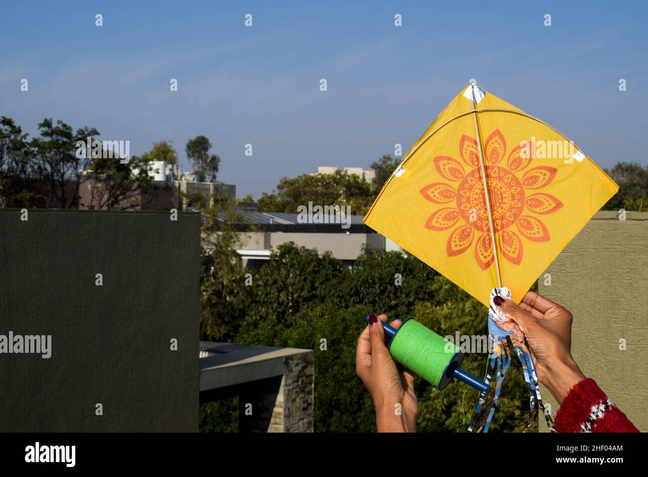 Female flying kite with sky background on occasion of Indian kite ...