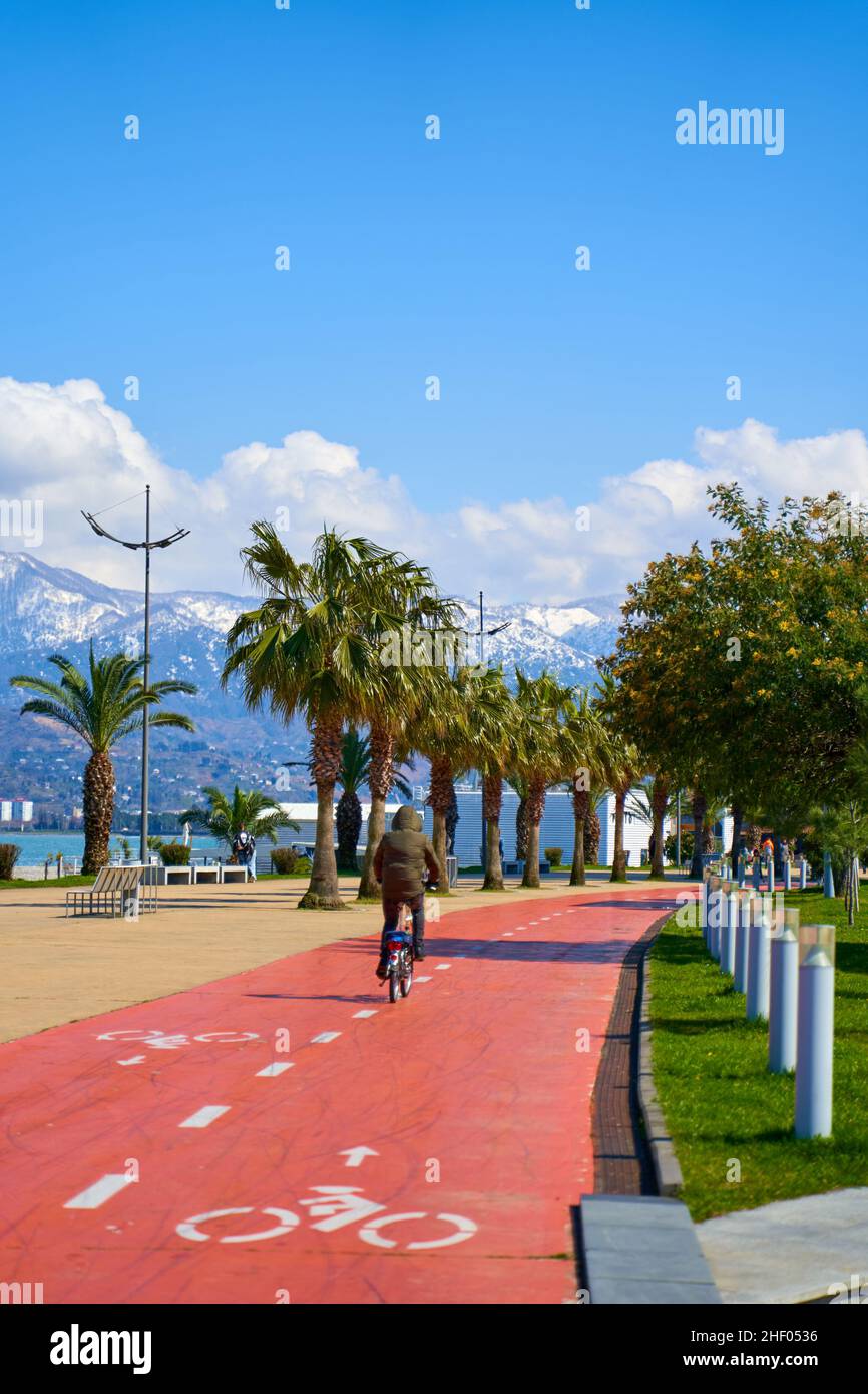 Cycle path across the entire embankment by the sea. The resort town of ...