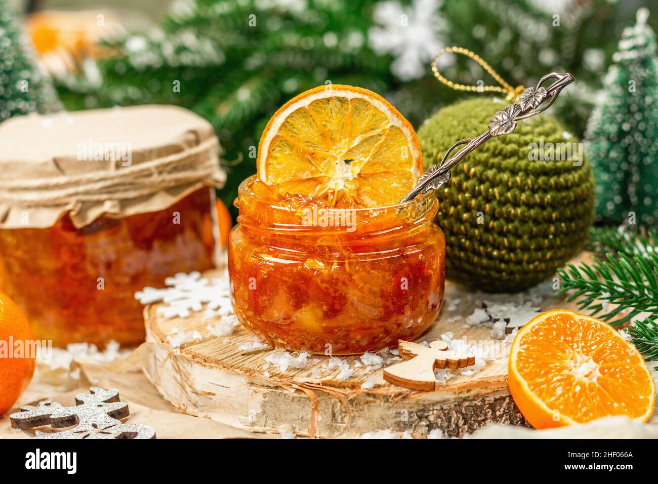 Orange marmalade or orange jam in glass jars. Sweet confiture with ...