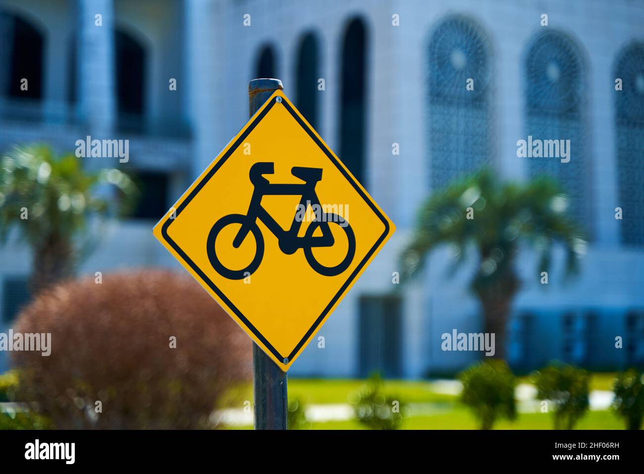 Diamond shaped sign with a bicycle. Alerting car drivers about a large ...
