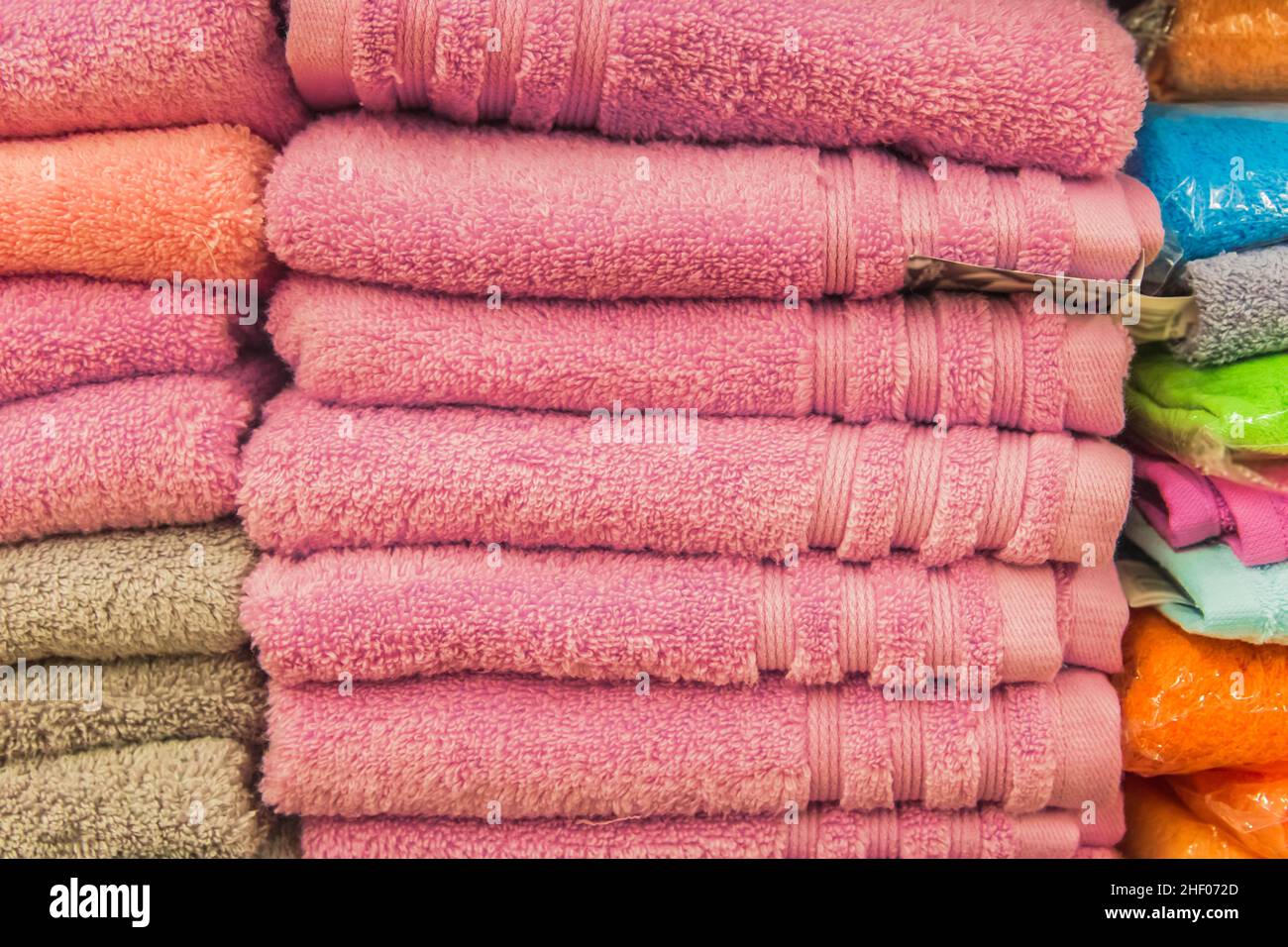 Pink and colorful clean towels soft hygiene at home in bathroom ...